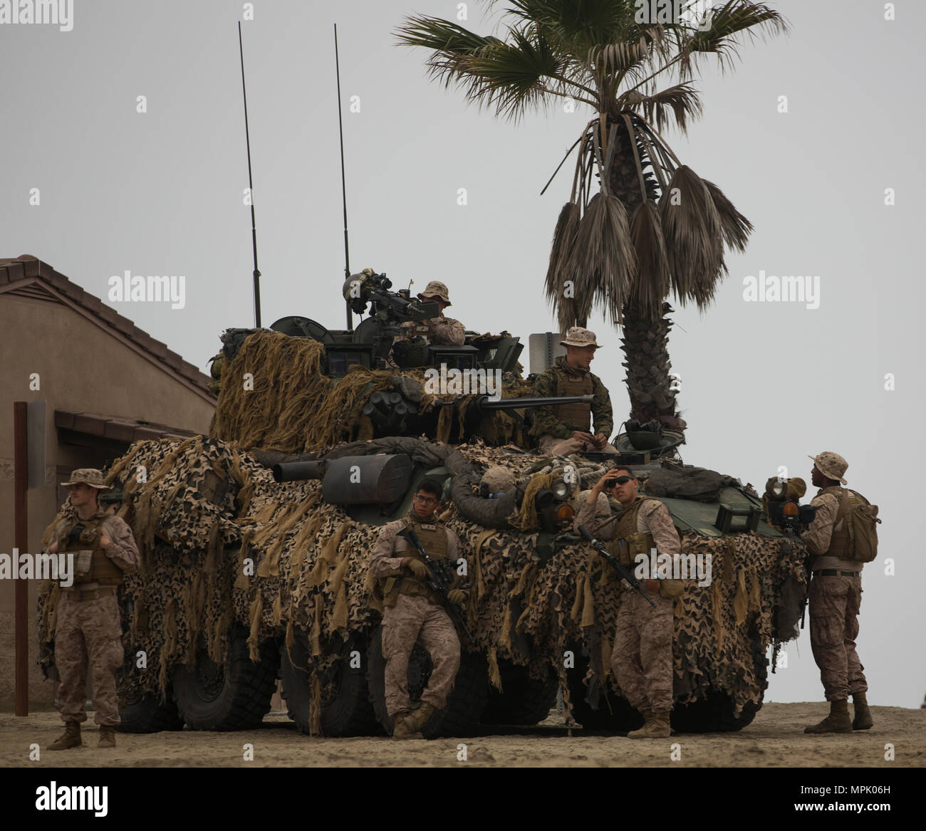 U.S. Marines with 1st Light Armored Reconnaissance Battalion (1st LAR) standby for a rafting ...
