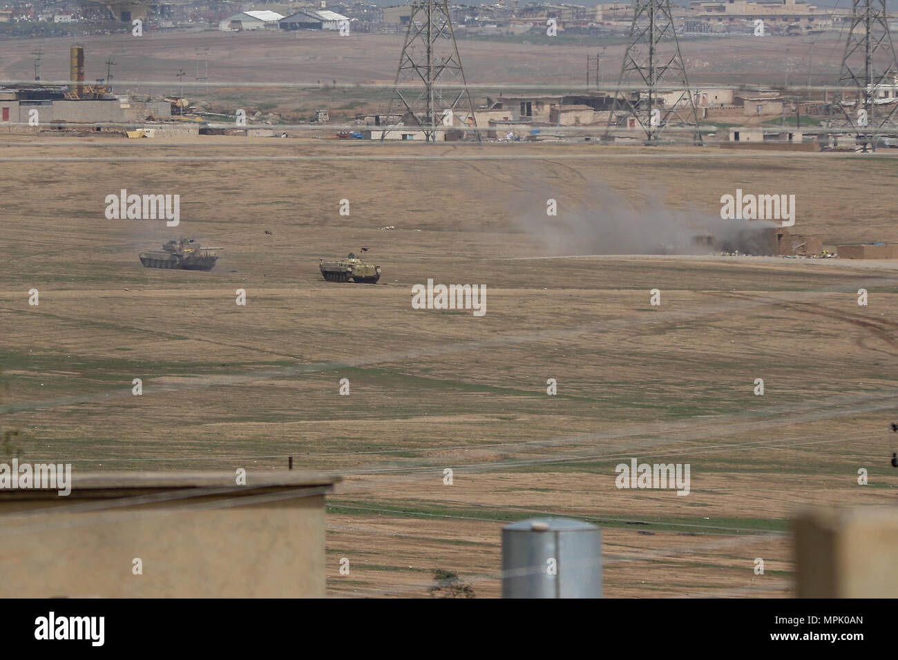 Heavy armor vehicles of the 9th Iraqi Army Division, supported by ...