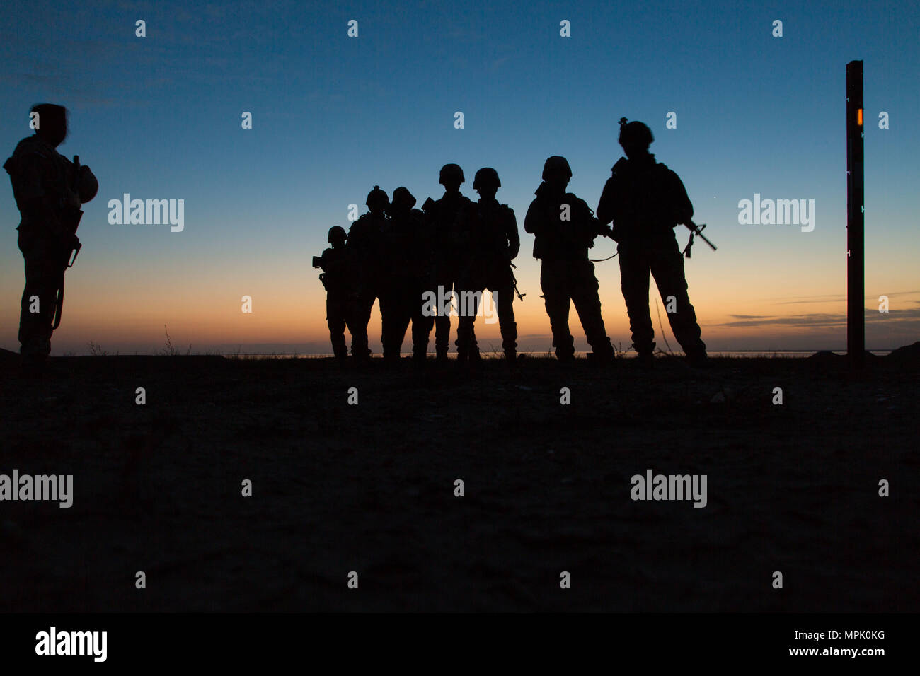 Iraqi security forces soldiers wait to begin urban assault night ...