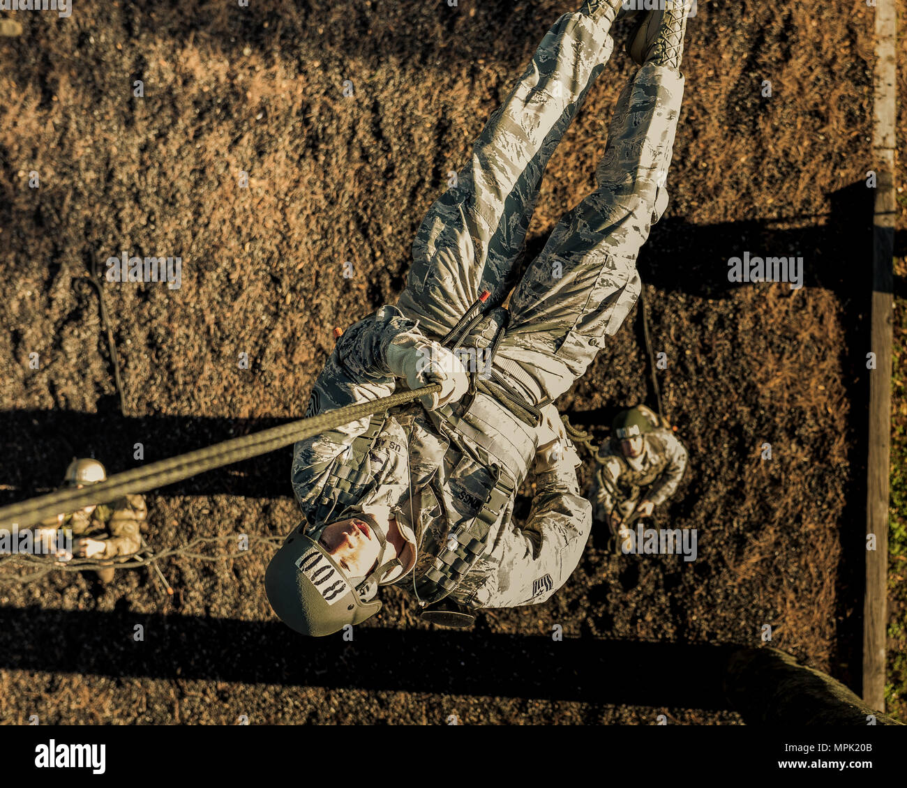 An Airman with the Florida National Guard rappels down a tower at Camp ...