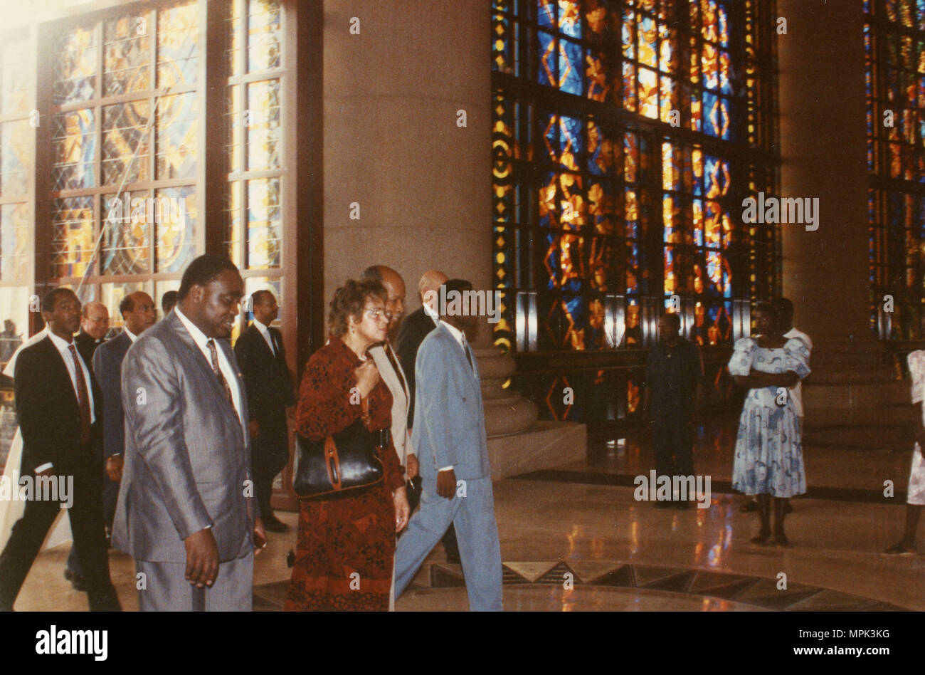 A GROUP OF MEN AND WOMEN WALKING INTO THE CHURCH Stock Photo - Alamy
