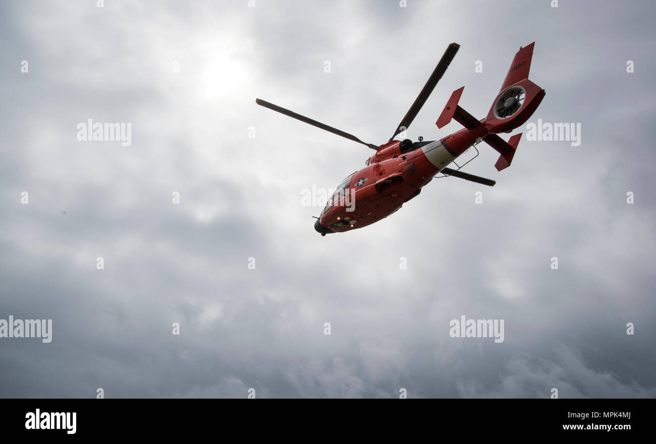 A Coast Guard MH-65 Dolphin helicopter flies over Point Vicente ...