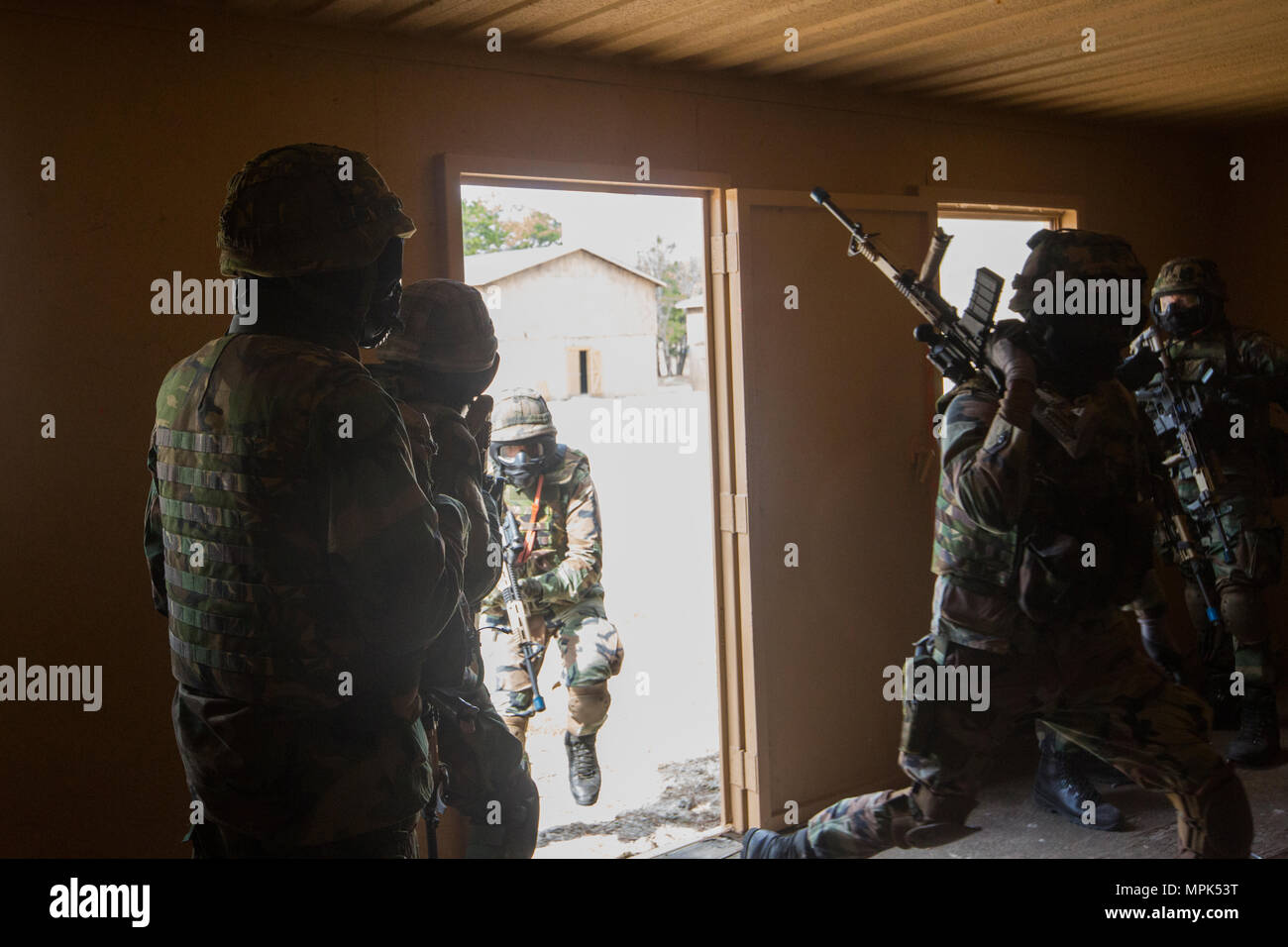 Royal Netherlands Marines with the Dutch Caribbean Forces enter a ...