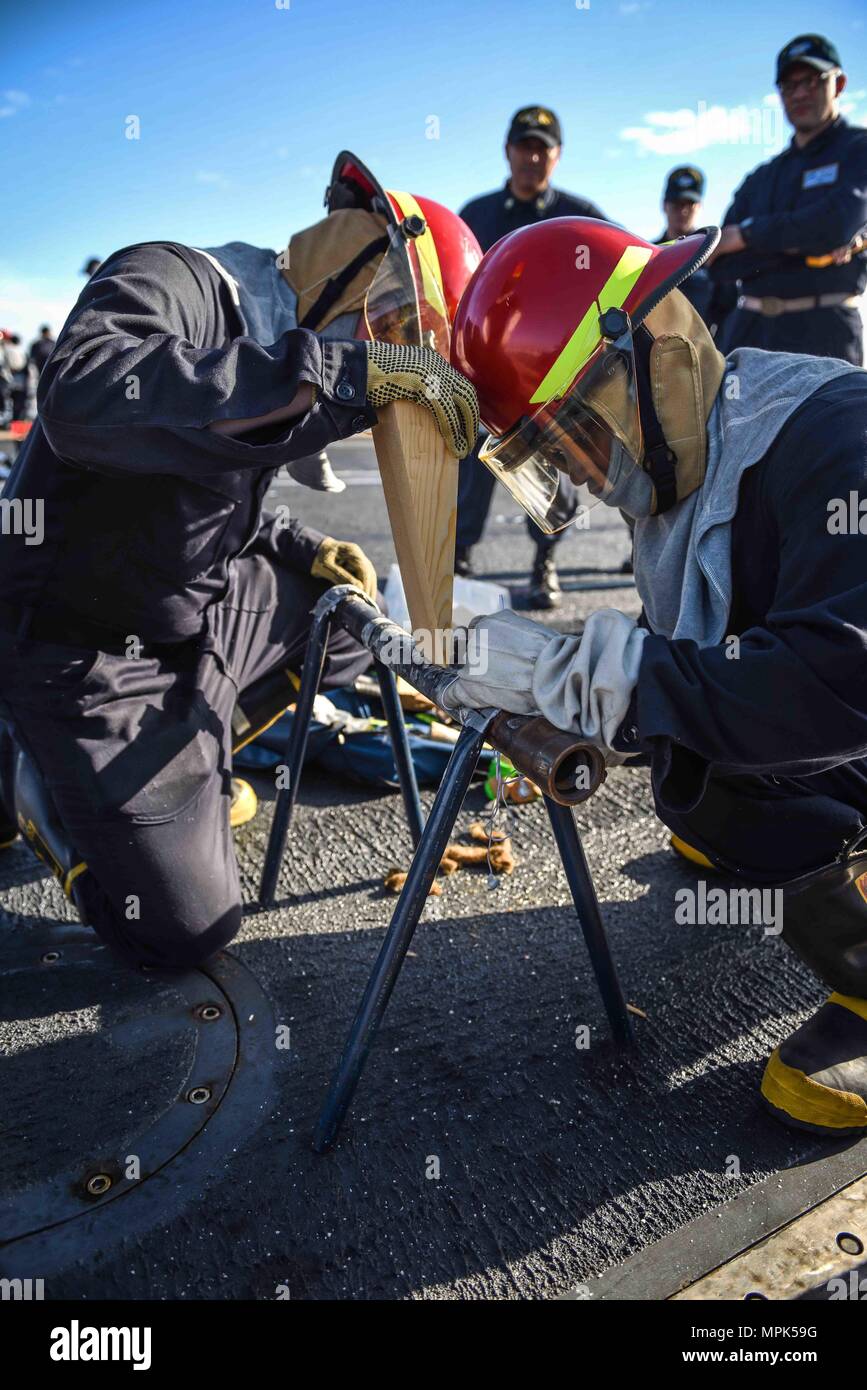 170321-N-MJ135-026 SAN DIEGO (Mar. 21, 2017) Sailors practice pipe ...