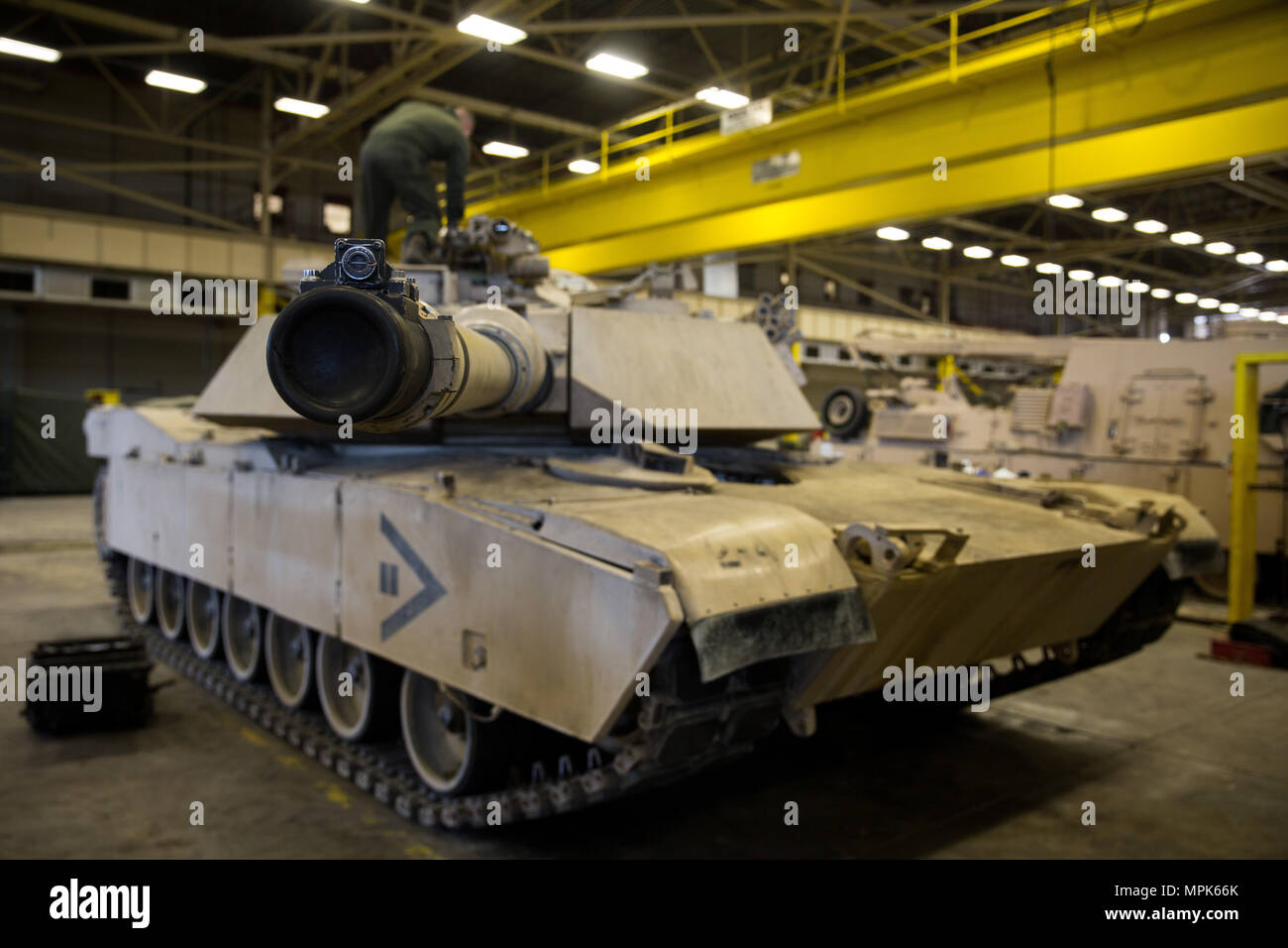 Marines finish up the final touches on an M1A1 Abrams tank after ...