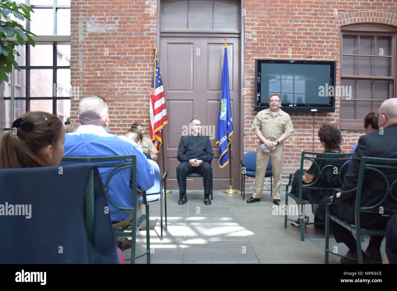 Cmdr. Michael Luken takes the Navy officer promotion oath of office ...