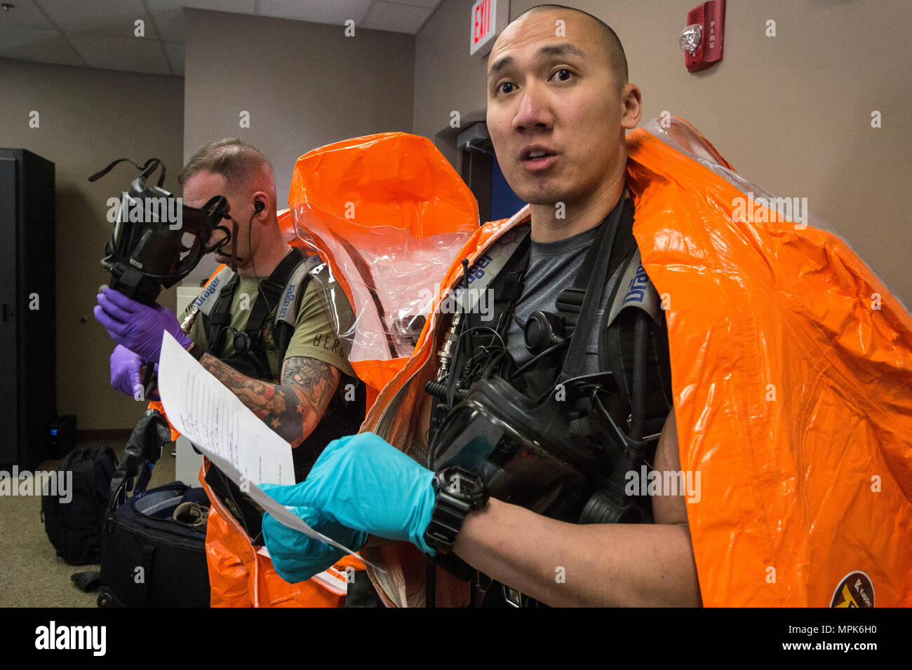Strike Team member Staff Sgt. Nicky Lam, right, with the New Jersey ...