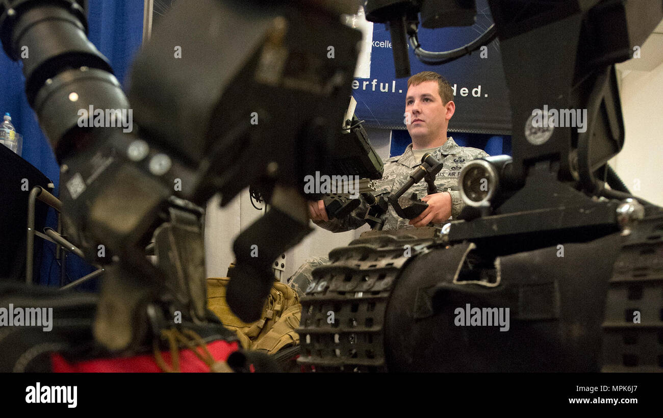 Air Force Tech Sgt. William Spencer operates a remote-controlled robot ...