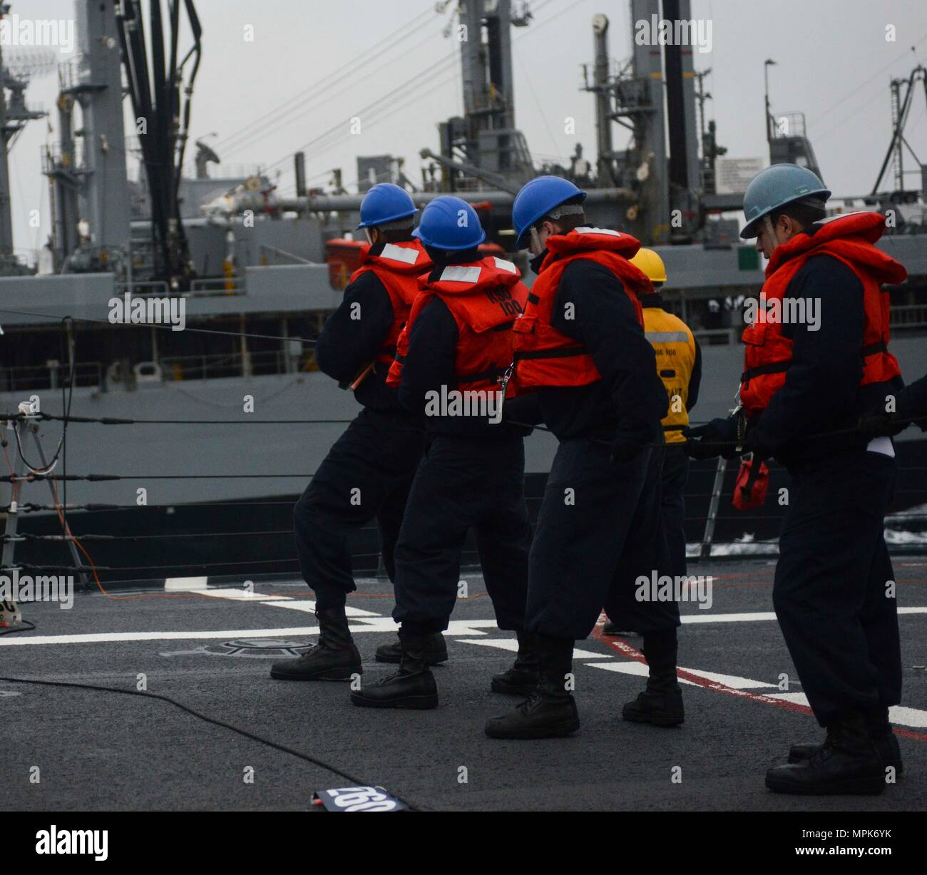 Sailors aboard USS Kidd (DDG 100) manage phone-and-distance line ...