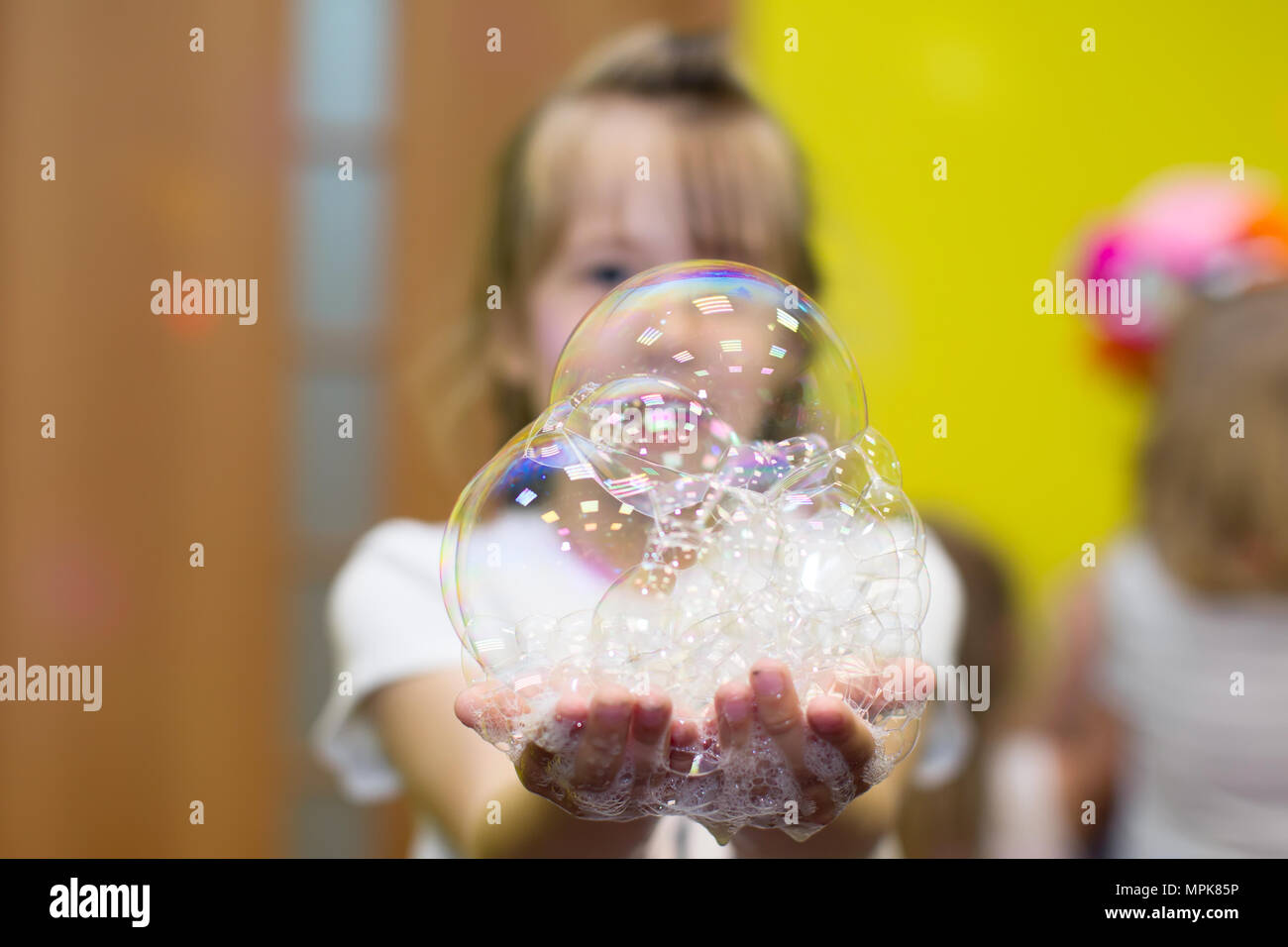 Soap bubbles in your hand Stock Photo - Alamy