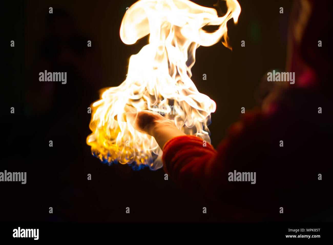 Fire on hand Stock Photo - Alamy