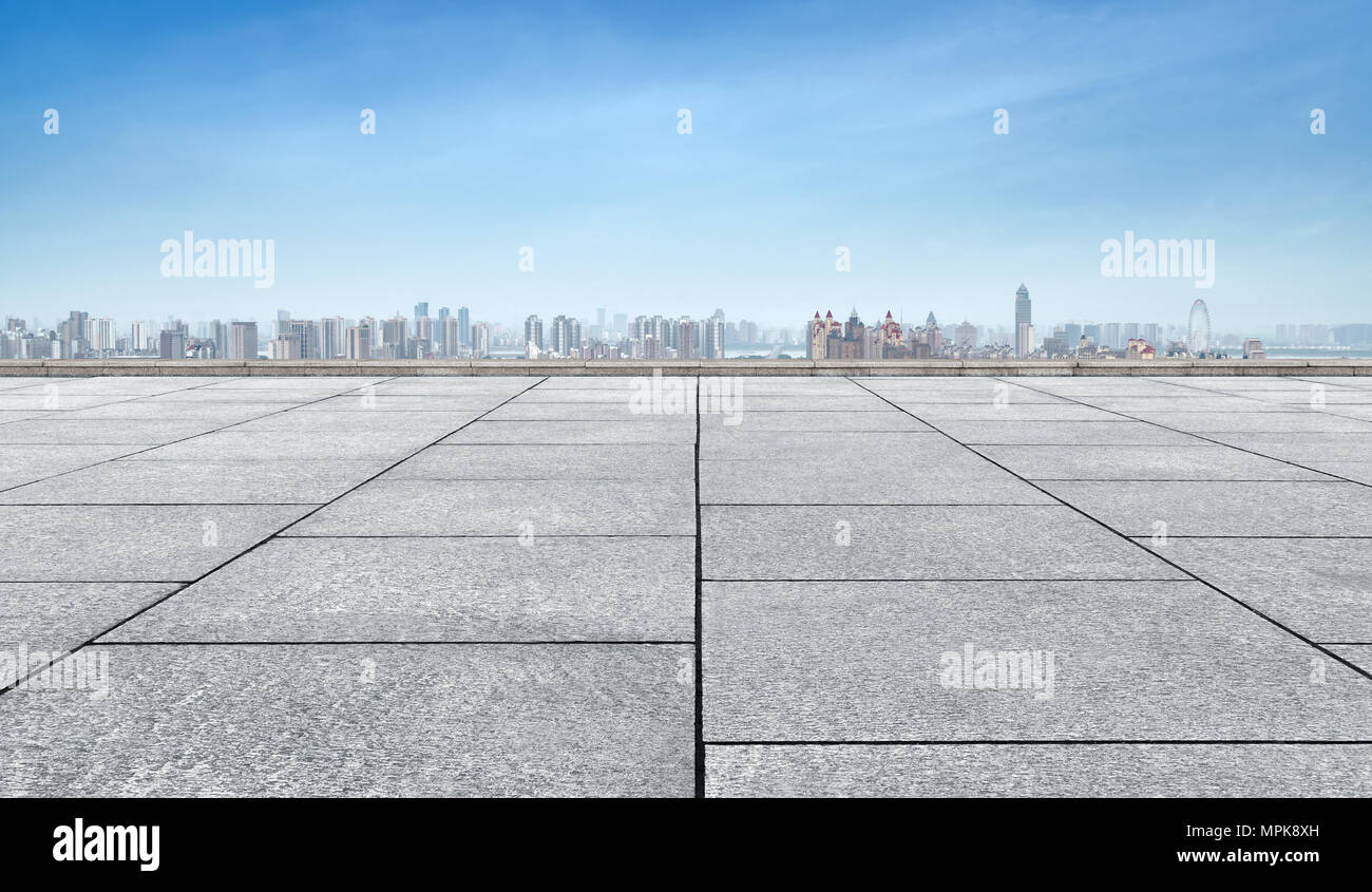 empty brick floor with cityscape of modern city Stock Photo - Alamy