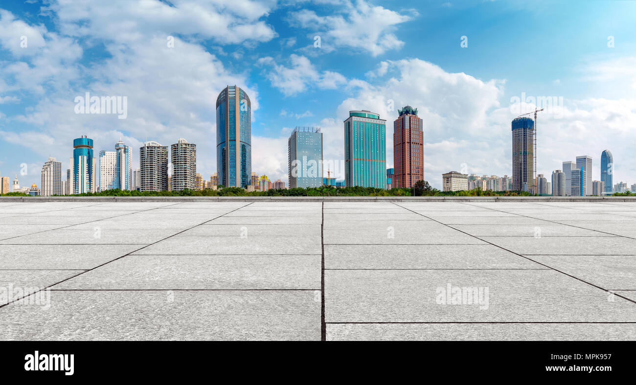 empty brick floor with cityscape of modern city Stock Photo - Alamy