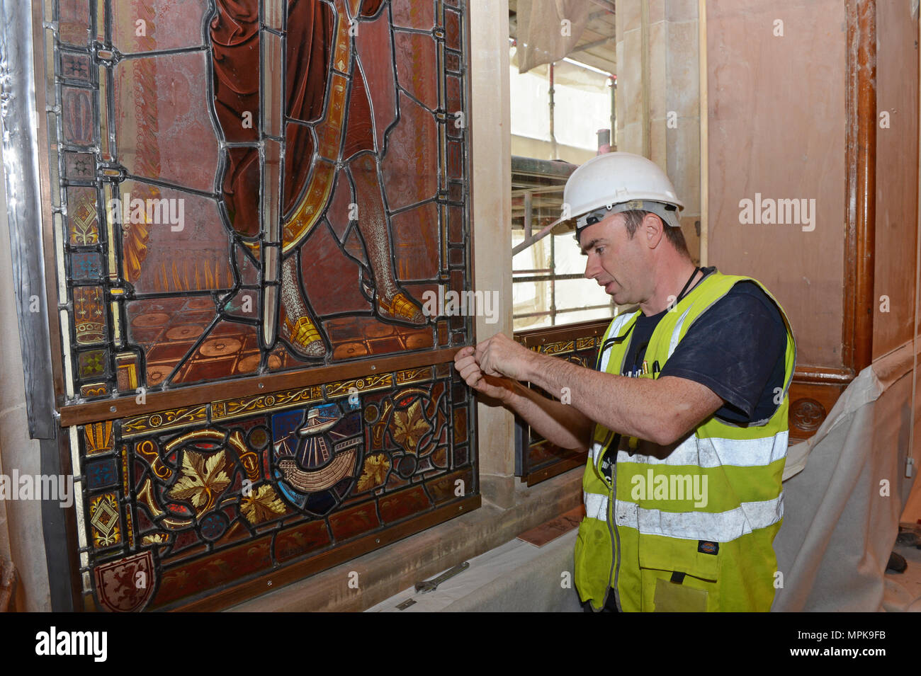 Man working on stained glass window refurbishment at Lerwick Town Hall ...
