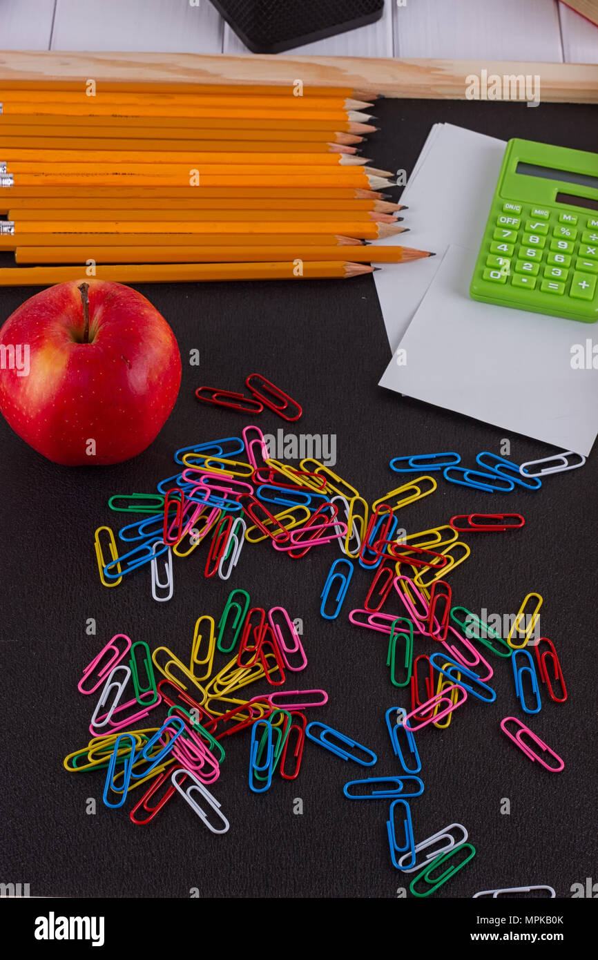 Overhead view of back to school supplies positioned on bottom part of ...