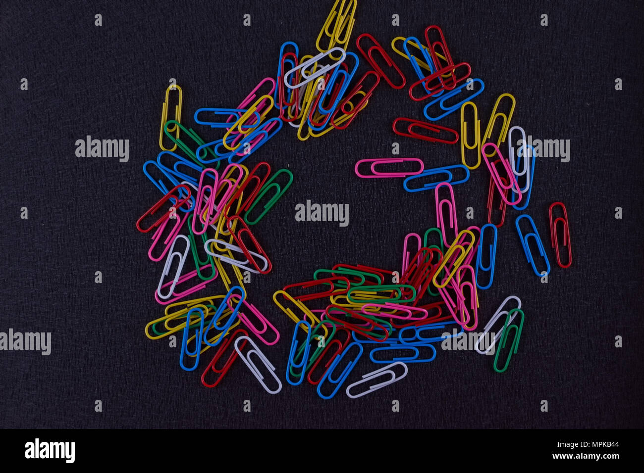 Many black paper clips hi-res stock photography and images - Alamy