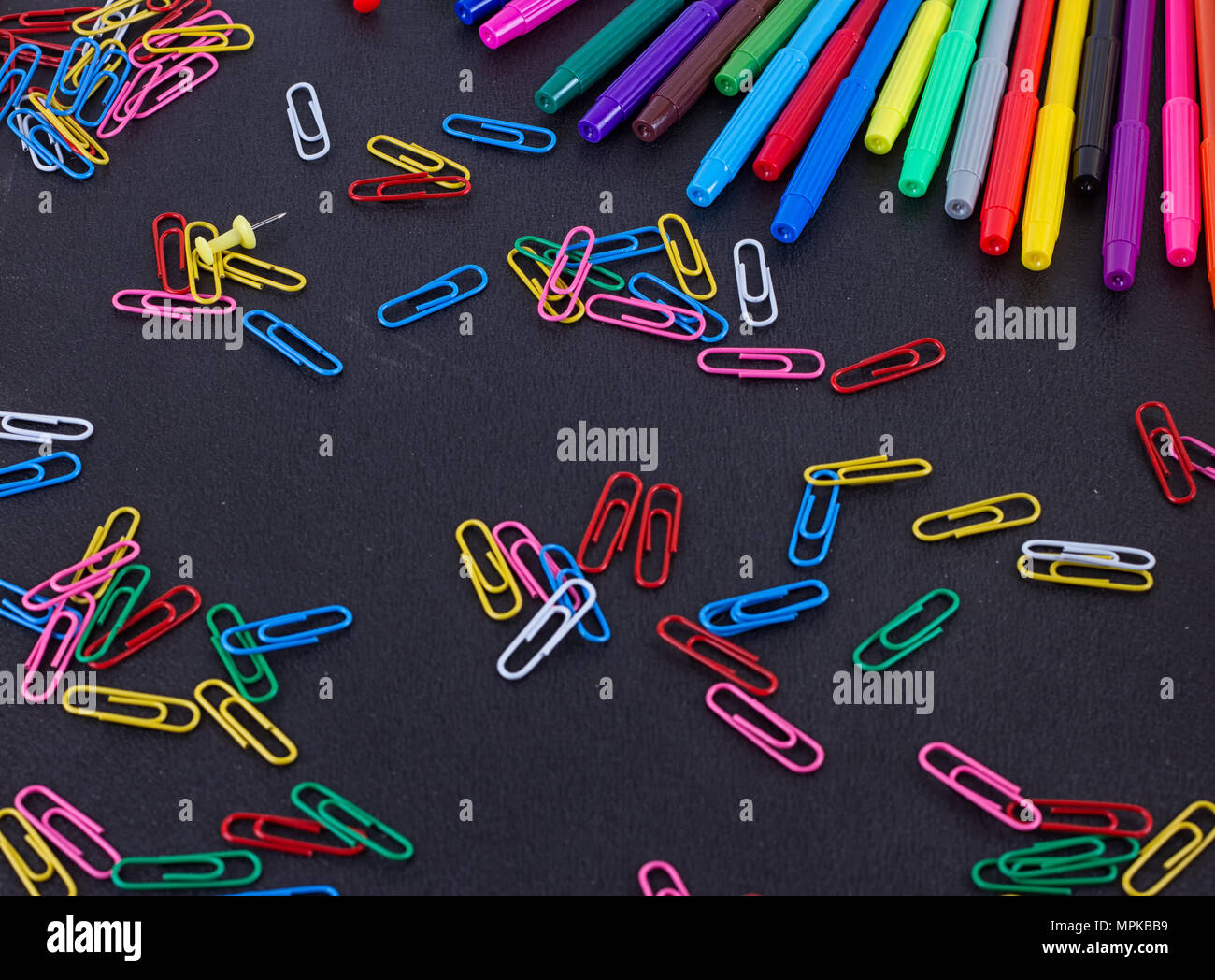 Material for school, paper clips, pencils colors Stock Photo - Alamy
