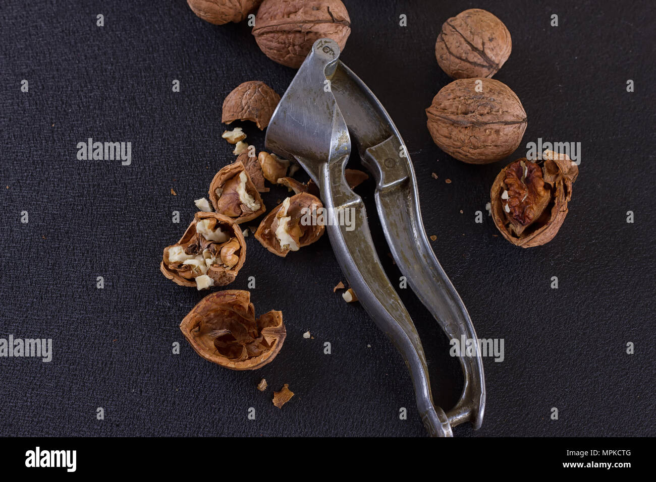 Greek nuts whole and split and the Nutcracker Stock Photo - Alamy