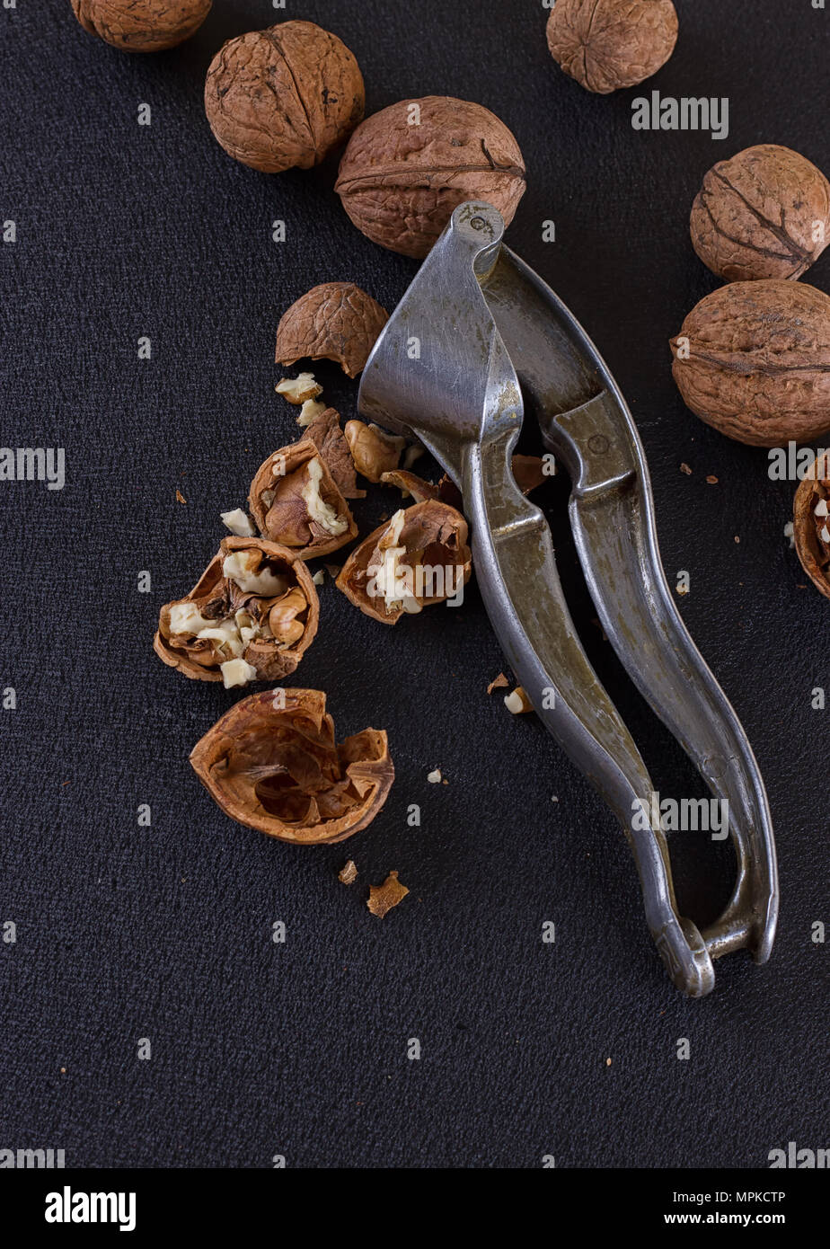 Greek nuts whole and split and the Nutcracker Stock Photo - Alamy