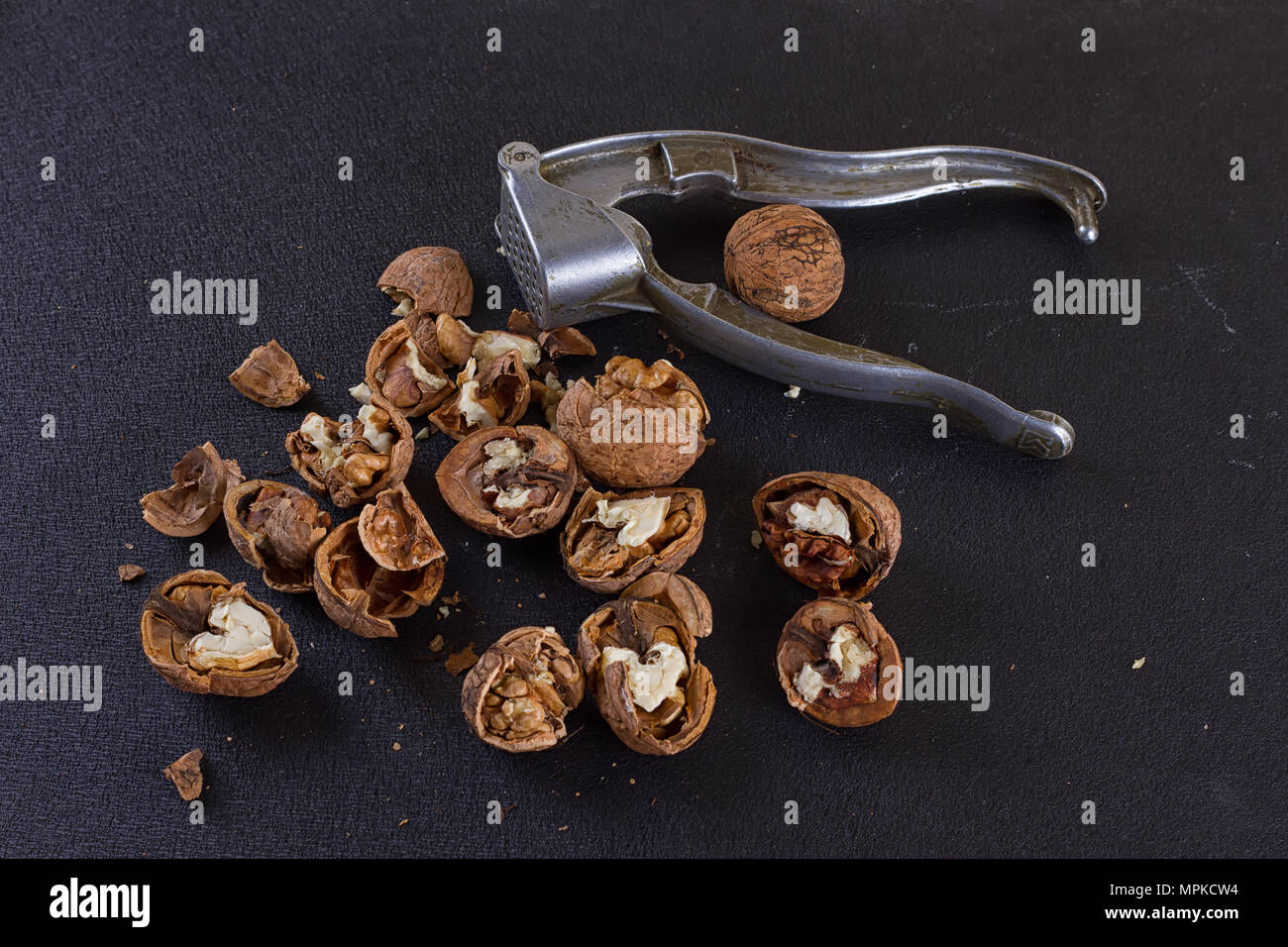 Greek nuts whole and split and the Nutcracker Stock Photo - Alamy