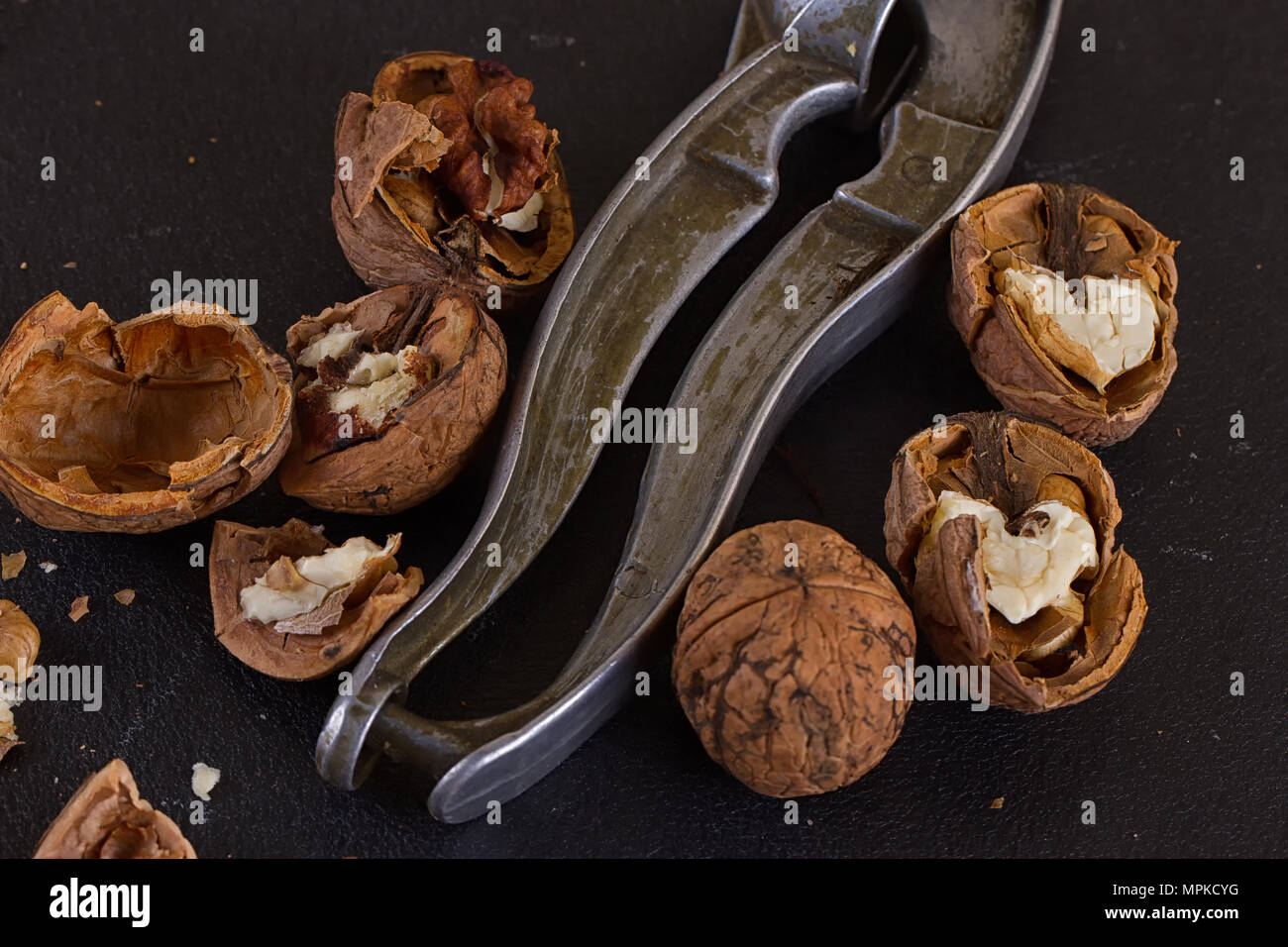 Greek nuts whole and split and the Nutcracker Stock Photo - Alamy