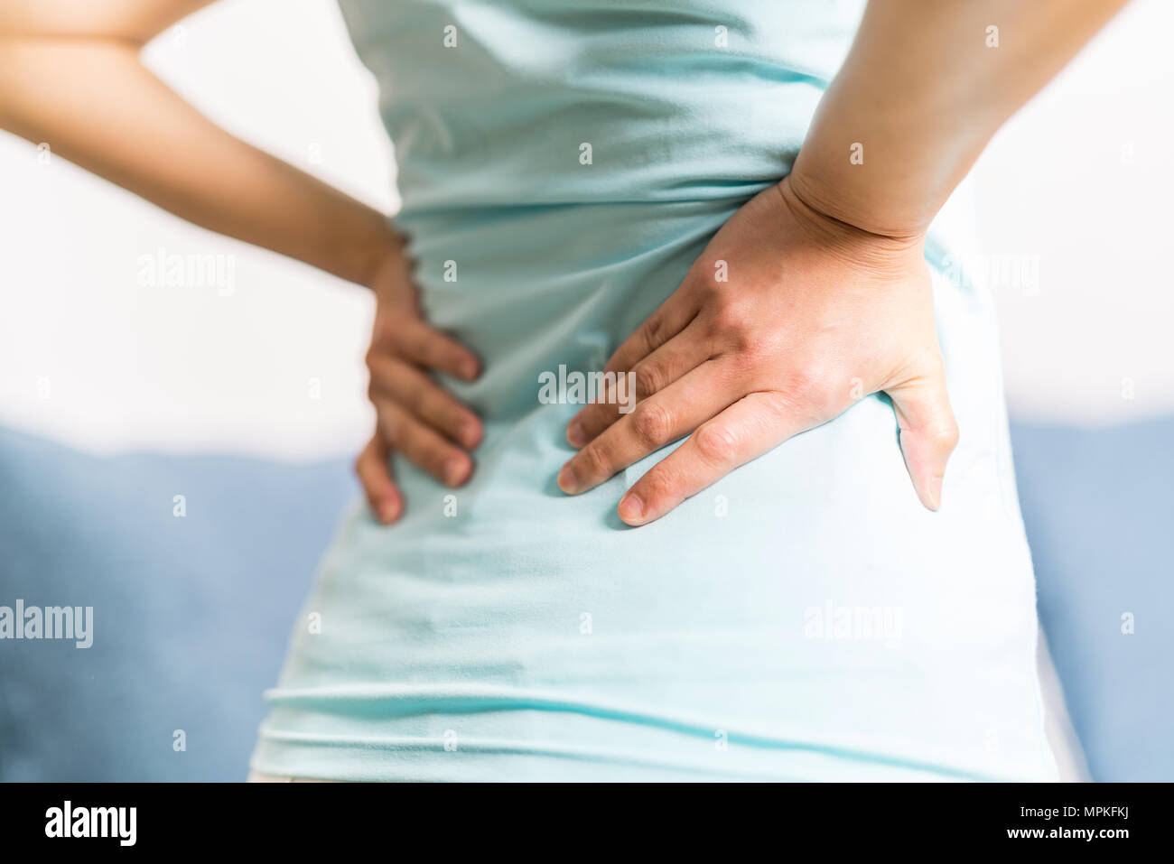 back pain at home. women suffer from backache. healthcare and medical ...