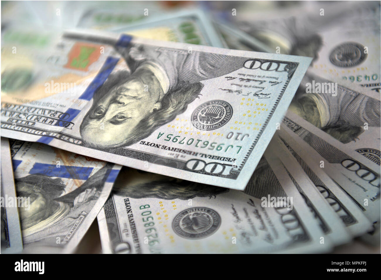New banknotes of dollars on a white background Stock Photo - Alamy