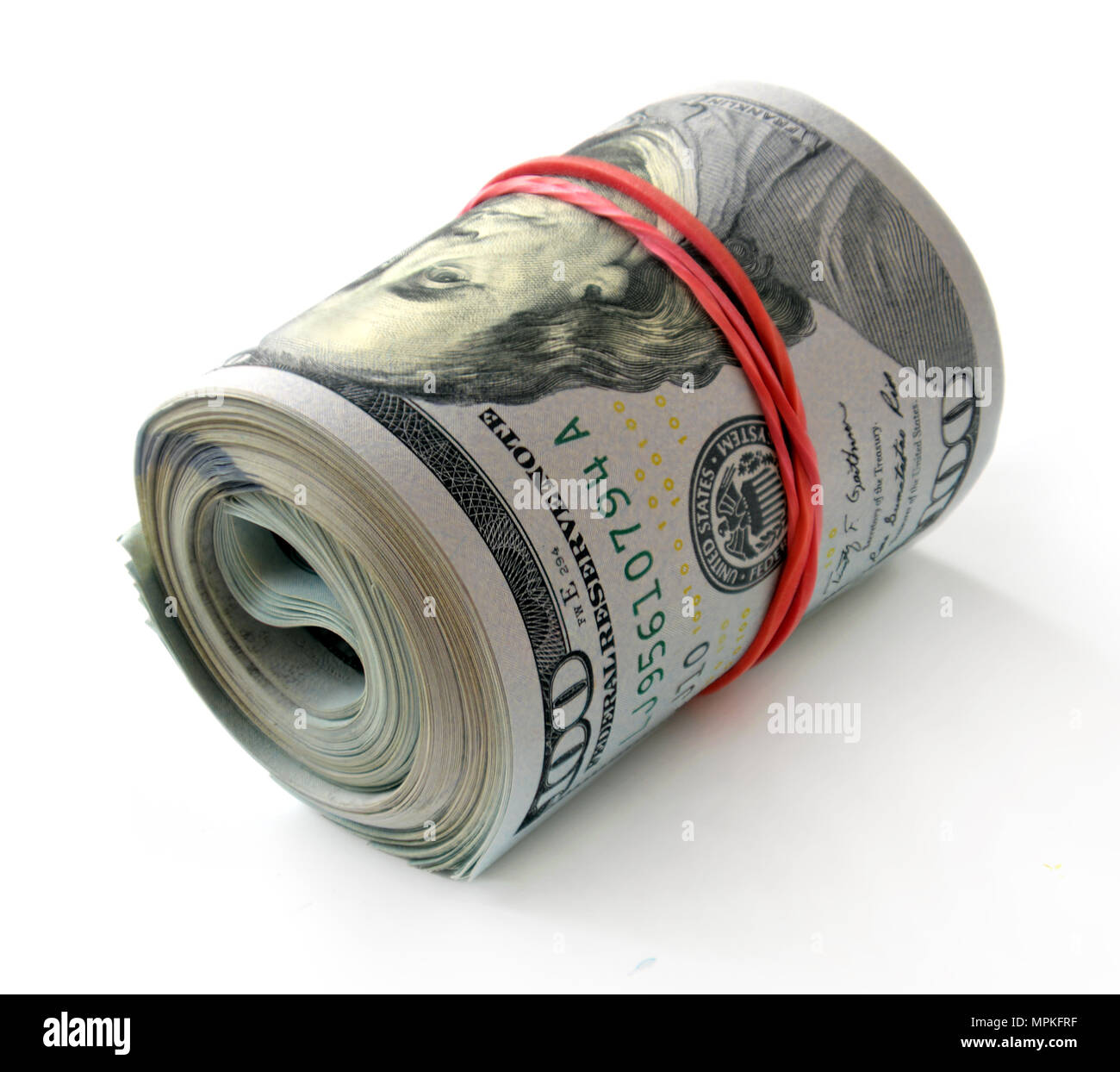 New banknotes of dollars roll on a white background Stock Photo - Alamy