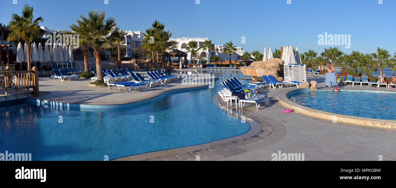 Africa, Egypt, January 12, 2016, Swimming pool with sun beds at the ...