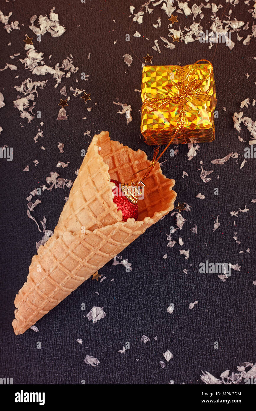 dutch wafers with red new year's ball on the black Stock Photo - Alamy