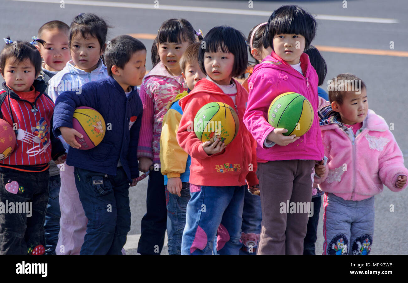 Beijing, China - April 27, 2010: Closeup of group of small children ...