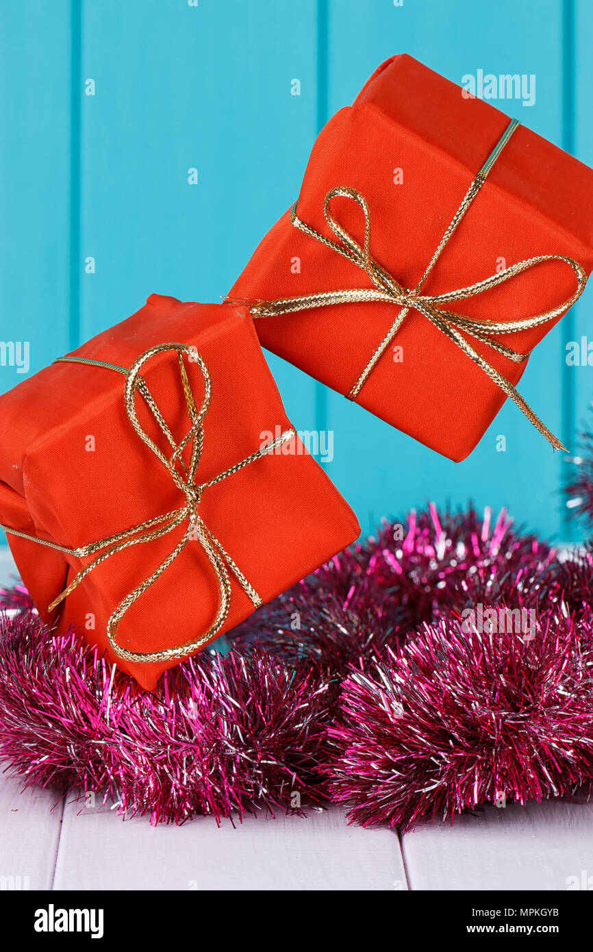 Gift box with dots floating in the air over blue background with copy ...