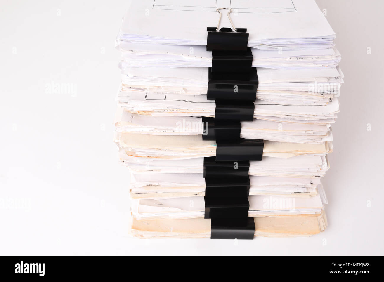 Paper stack storage and Black Paper Clip pace on white isolated ...