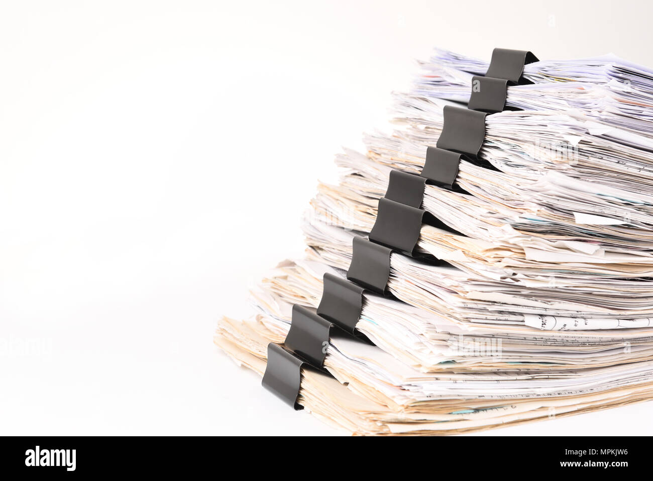 Paper stack storage and Black Paper Clip pace on white isolated ...