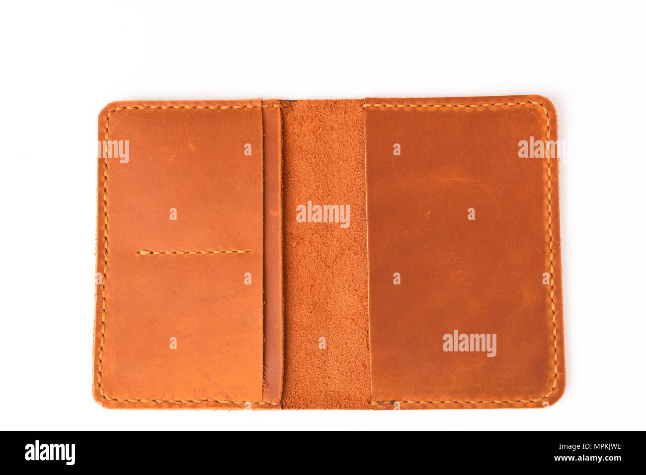 Brown wallet made of handmade leather on white isolated background ...