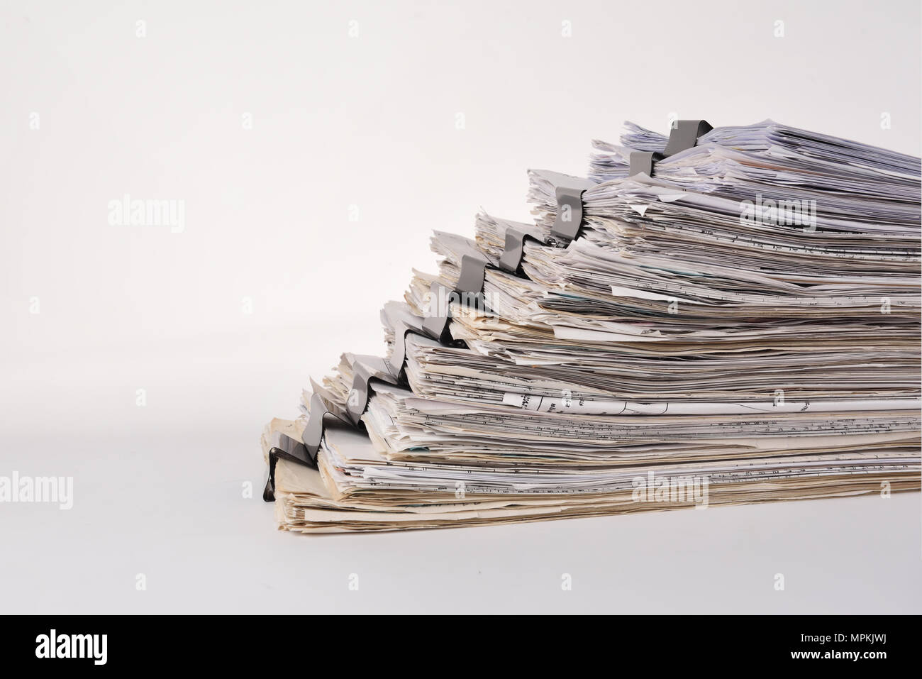 Paper stack storage and Black Paper Clip pace on white isolated ...