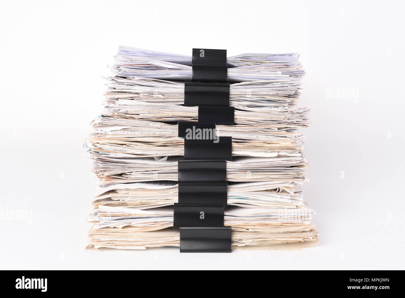 Paper stack storage and Black Paper Clip pace on white isolated ...