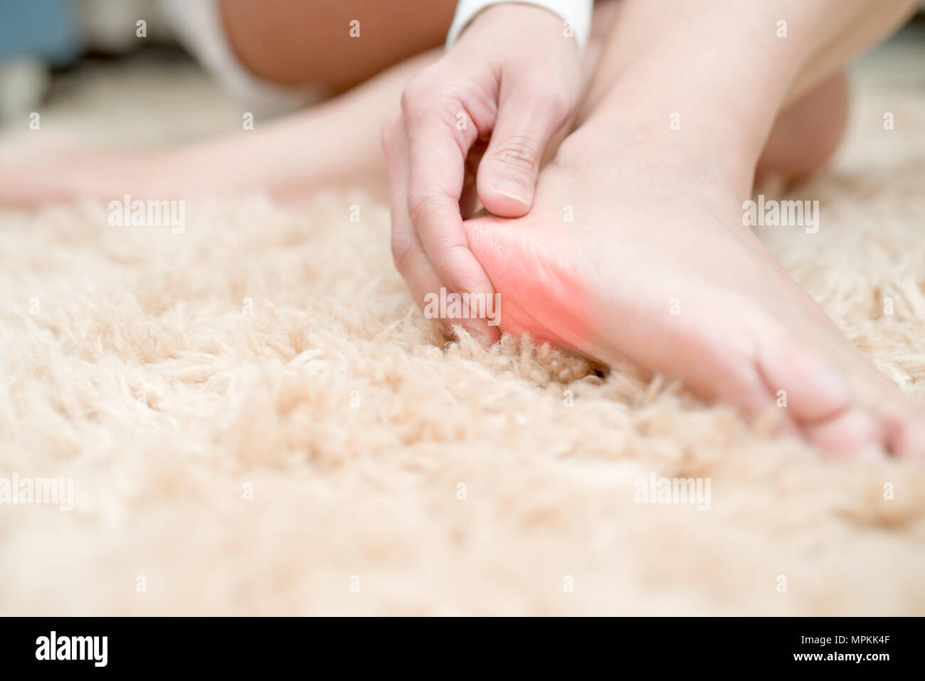 foot ankle injury pain women touch her foot painful, healthcare and ...