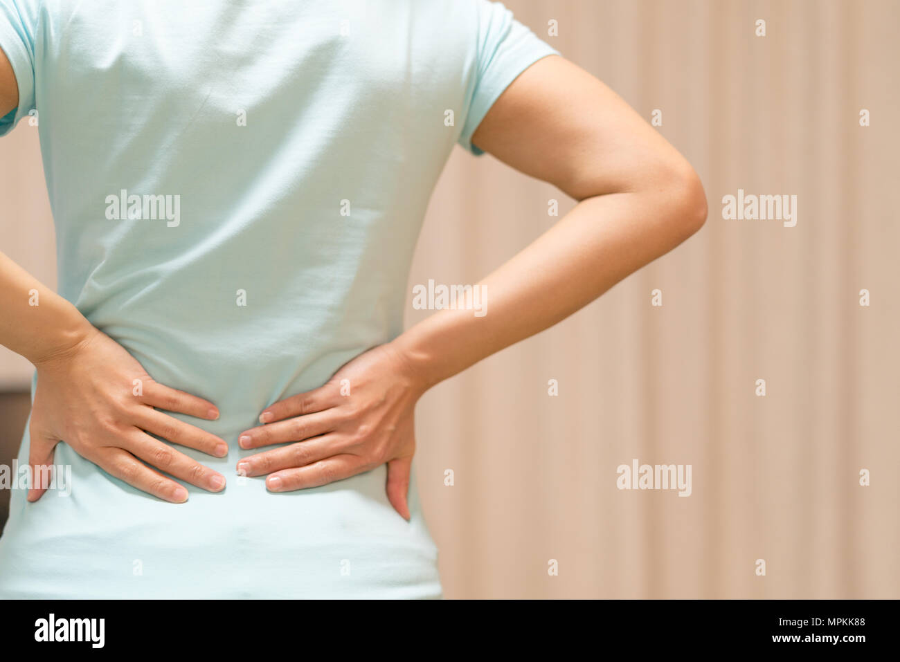 back pain at home. women suffer from backache. healthcare and medical ...