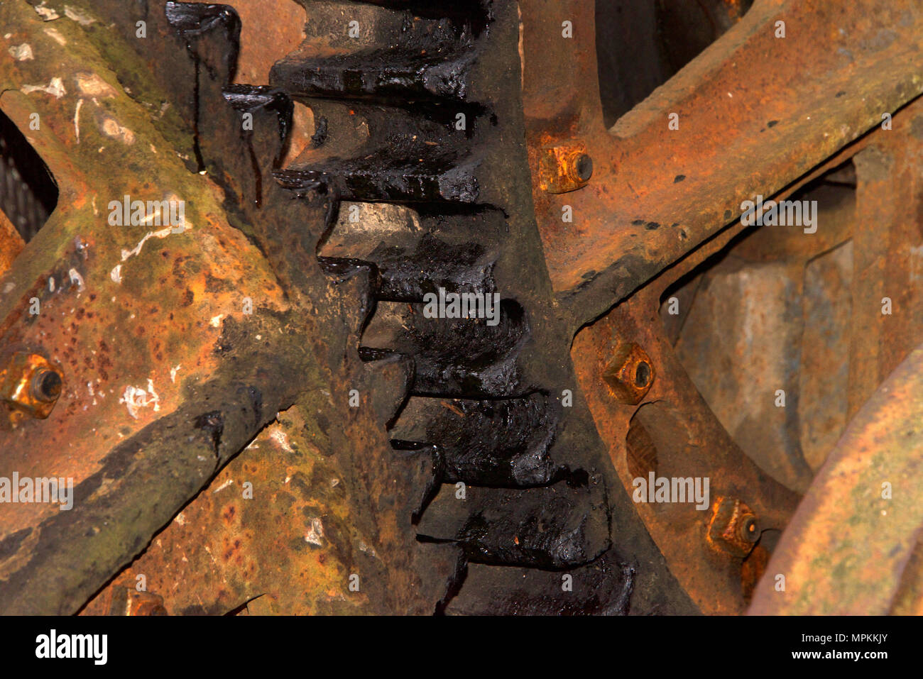 Two rusty old gears lined up from an old saw mill Stock Photo - Alamy