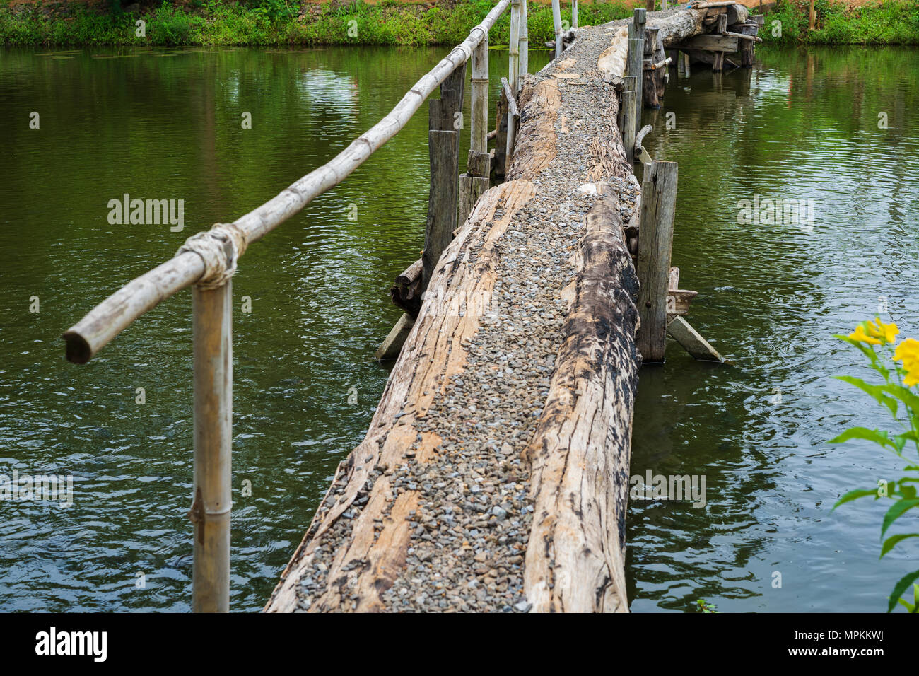 walking bridge across small river Stock Photo - Alamy