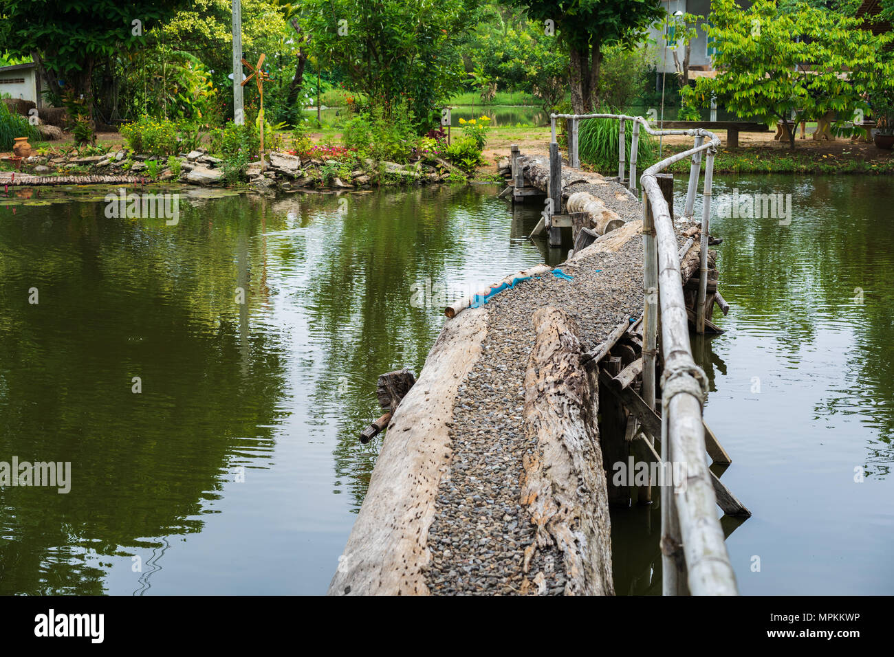 walking bridge across small river Stock Photo - Alamy