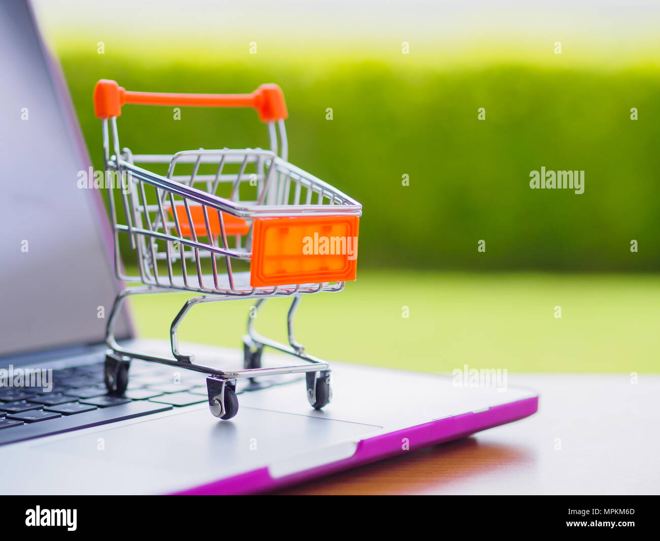 Shopping Online Concept : Mini Shopping Cart On Laptop Stock Photo - Alamy
