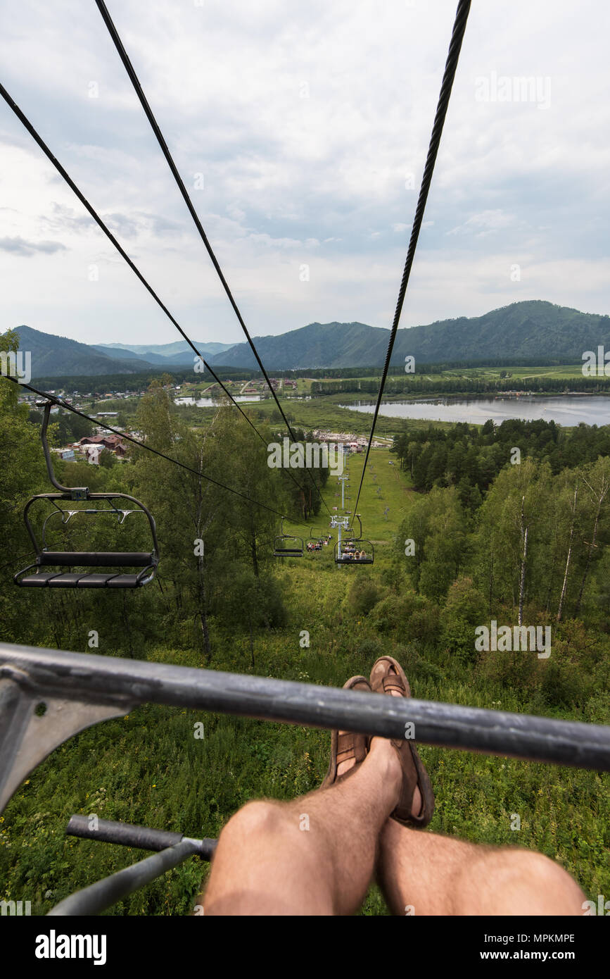 Aerial cable car riding up Stock Photo - Alamy