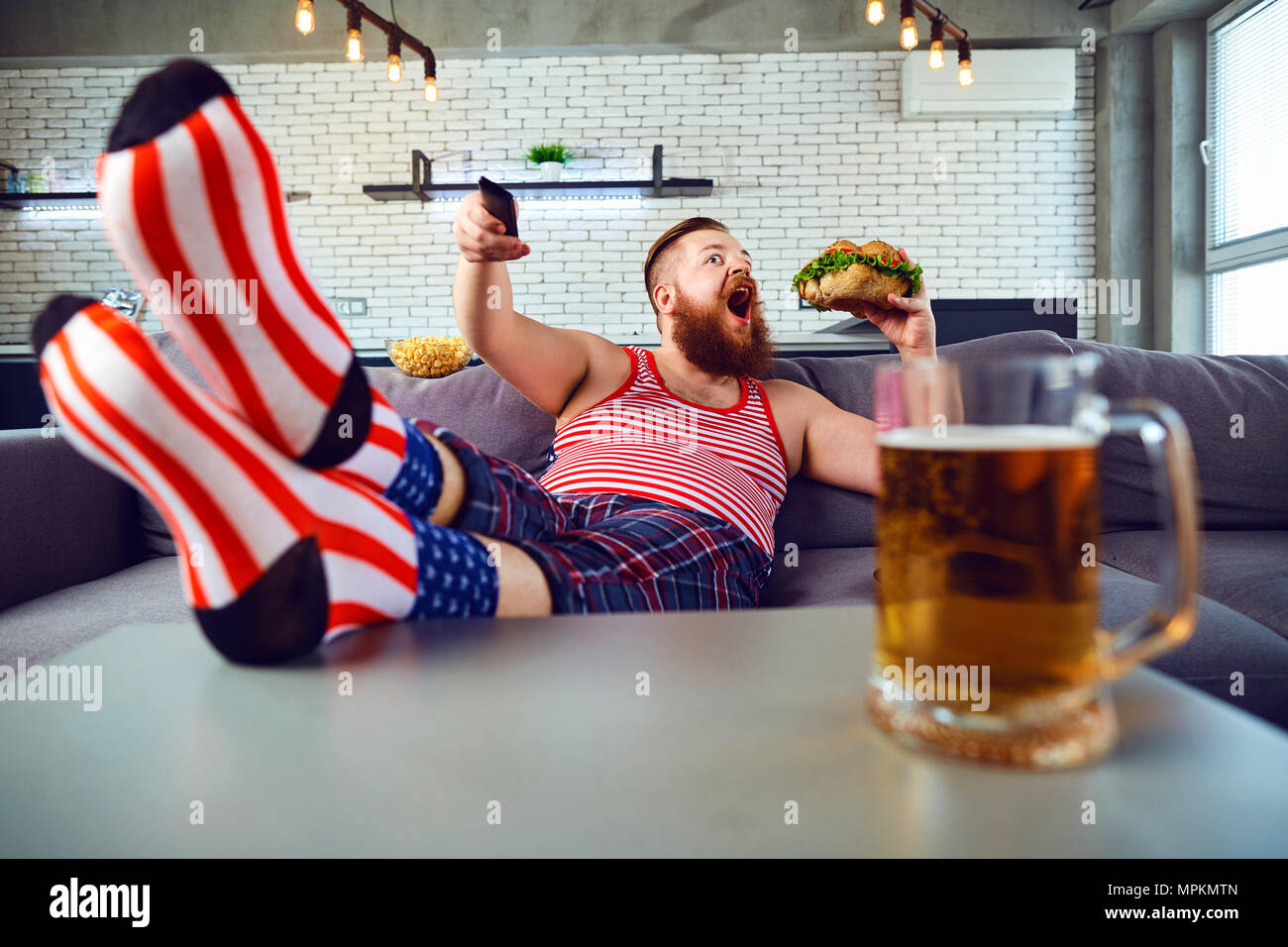 Fat man eating hamburger on hi-res stock photography and images - Alamy