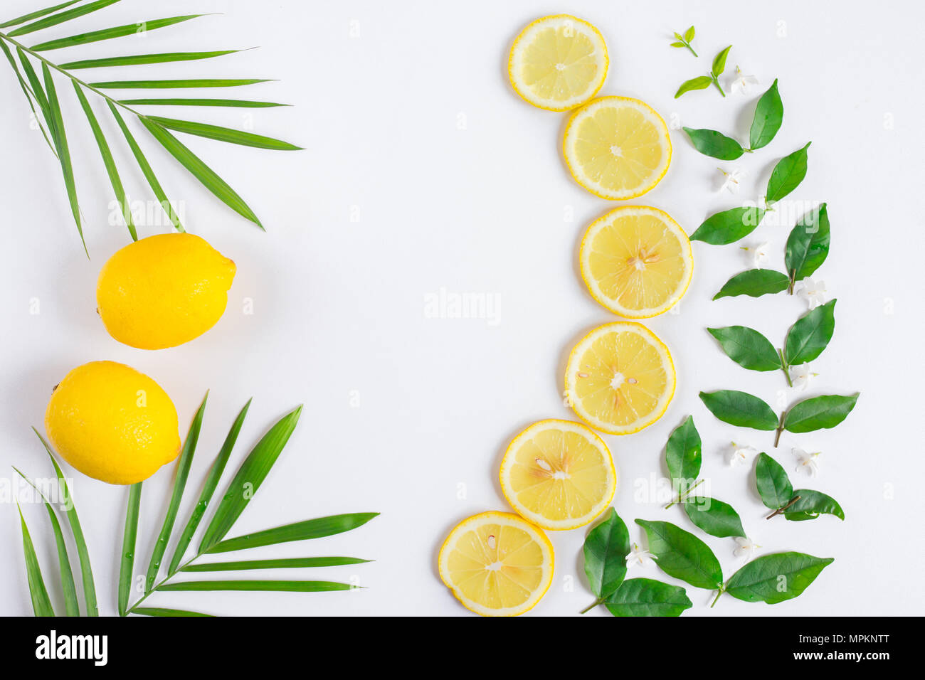 Flat lay image of fresh lemon with lemon slice on white background with ...