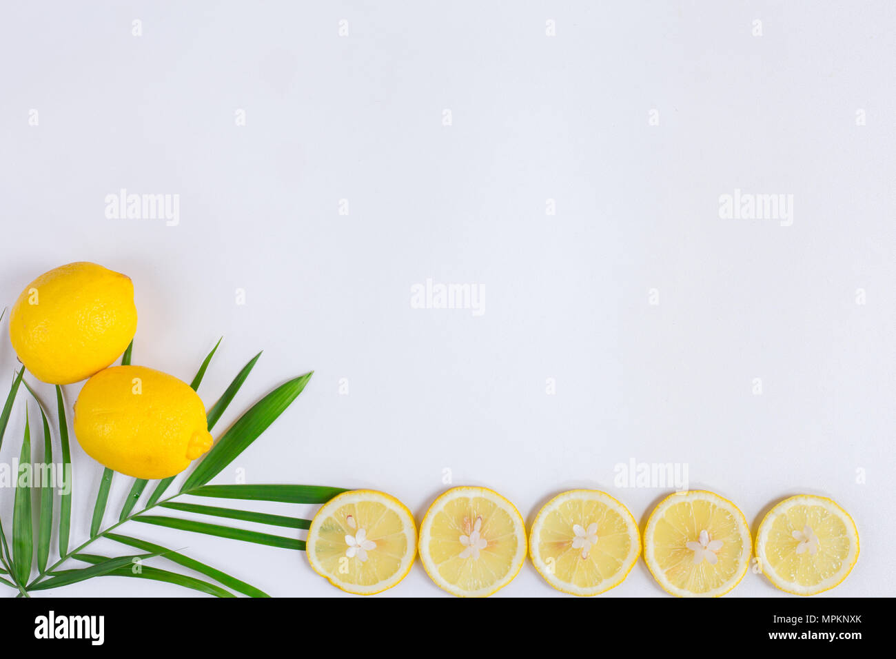 Flat lay image of fresh lemon with lemon slice on white background with ...