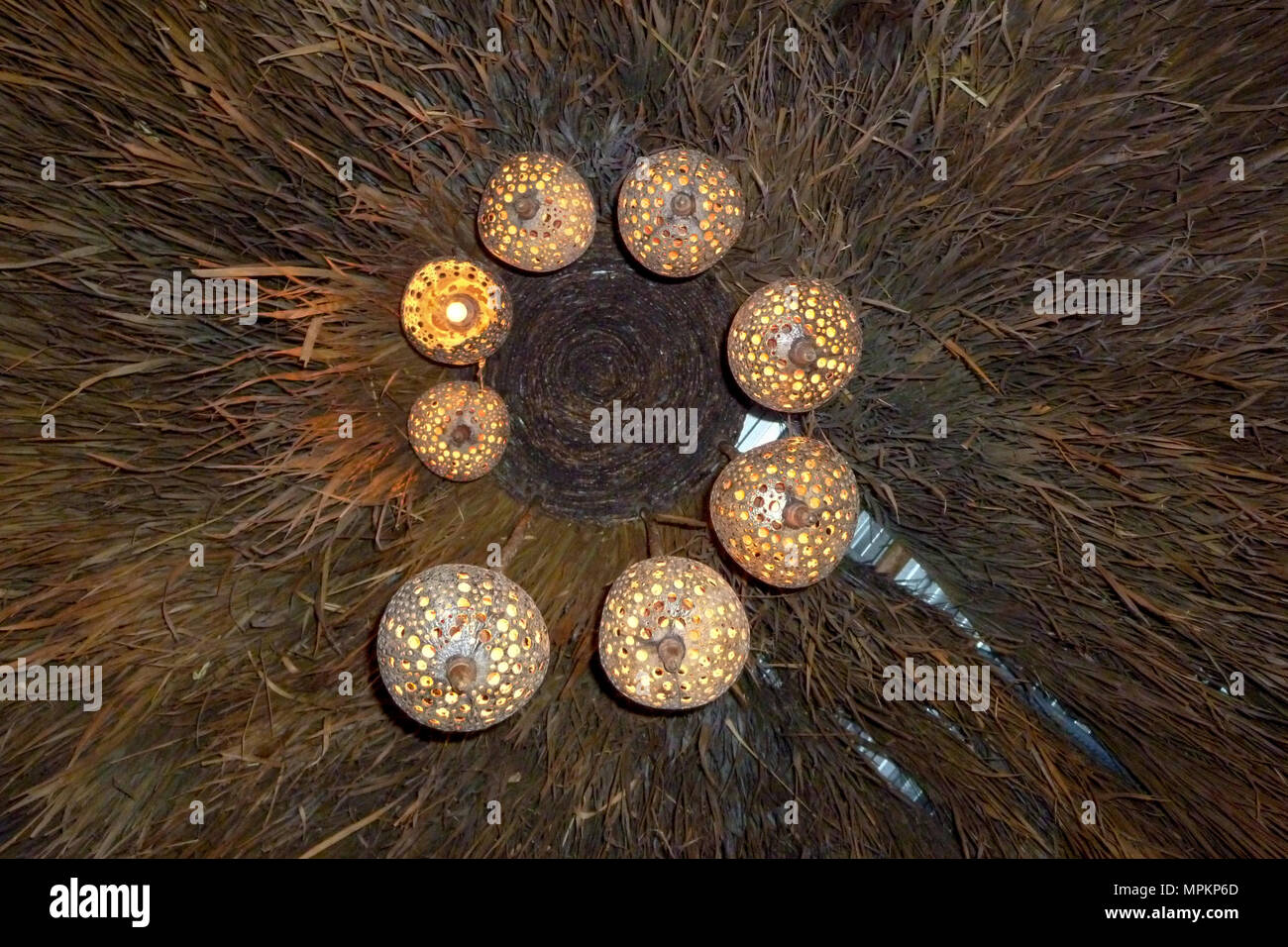wooden lamps hanging in a circle from the roof Stock Photo - Alamy