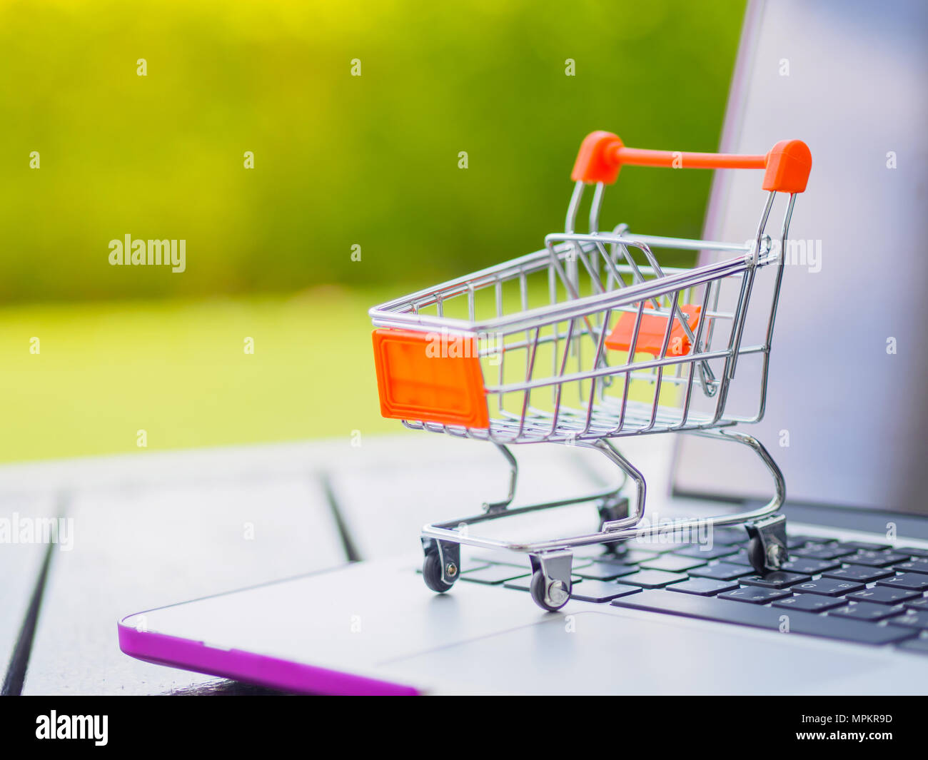 Shopping Online Concept : Mini Shopping Cart On Laptop Stock Photo - Alamy