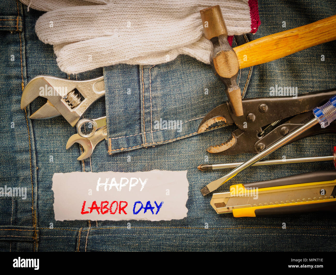 Labor day background concept - Jeans, many handy tools with labor day ...
